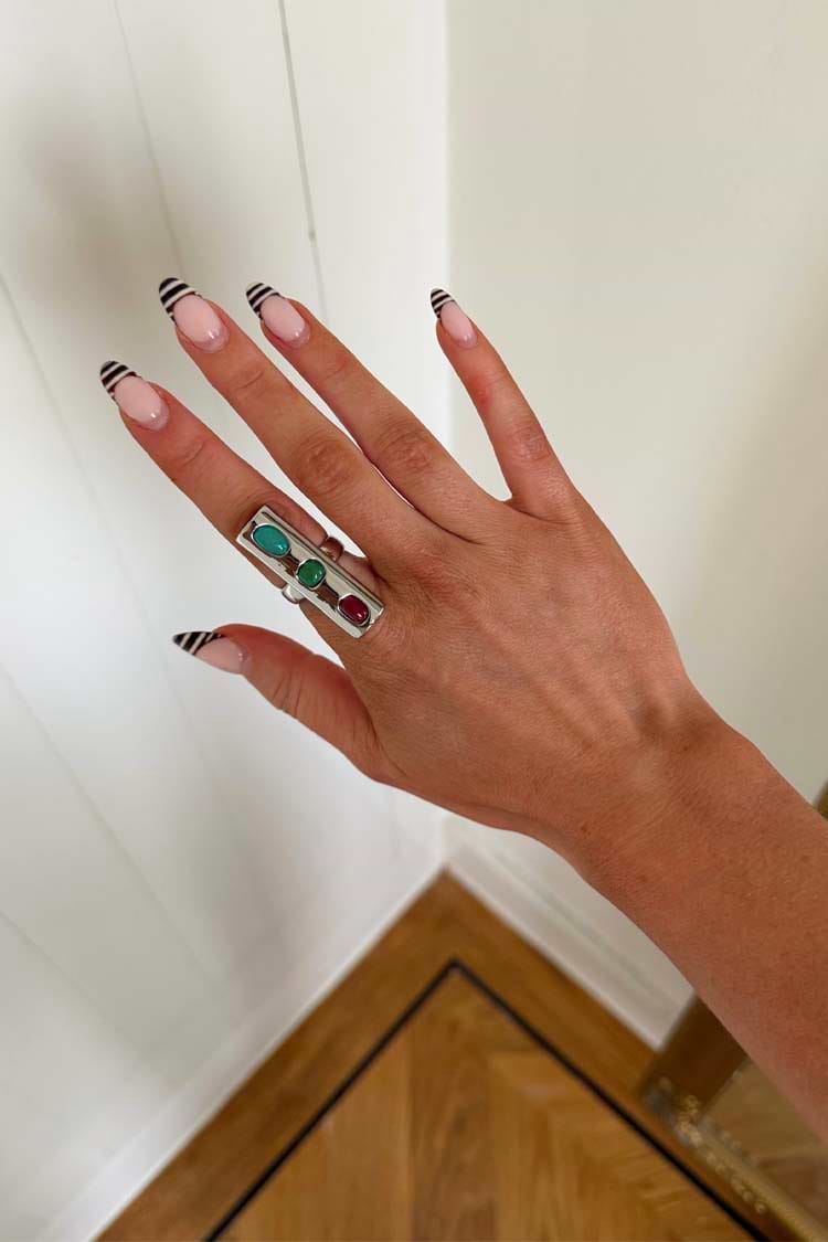 Deloris Whistle Ring – Never Fully Dressed